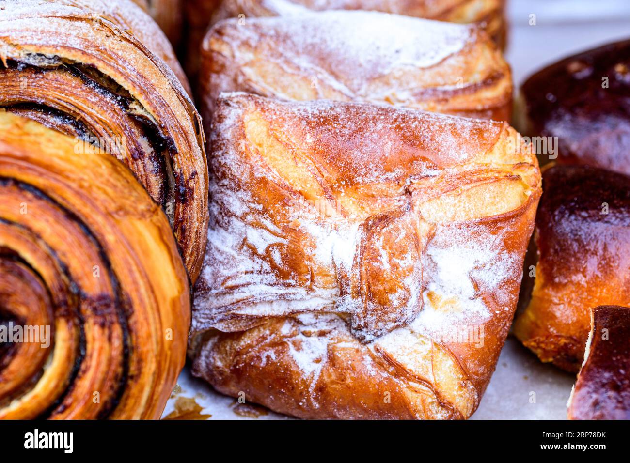 Bakery concept. Sweet pastries: chocolatey cocoa swirls and patties ...