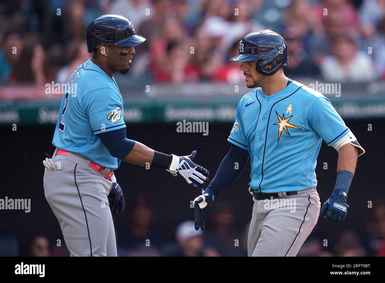 Tampa Bay Rays' Rene Pinto, right, is congratulated by Yandy Díaz, left ...