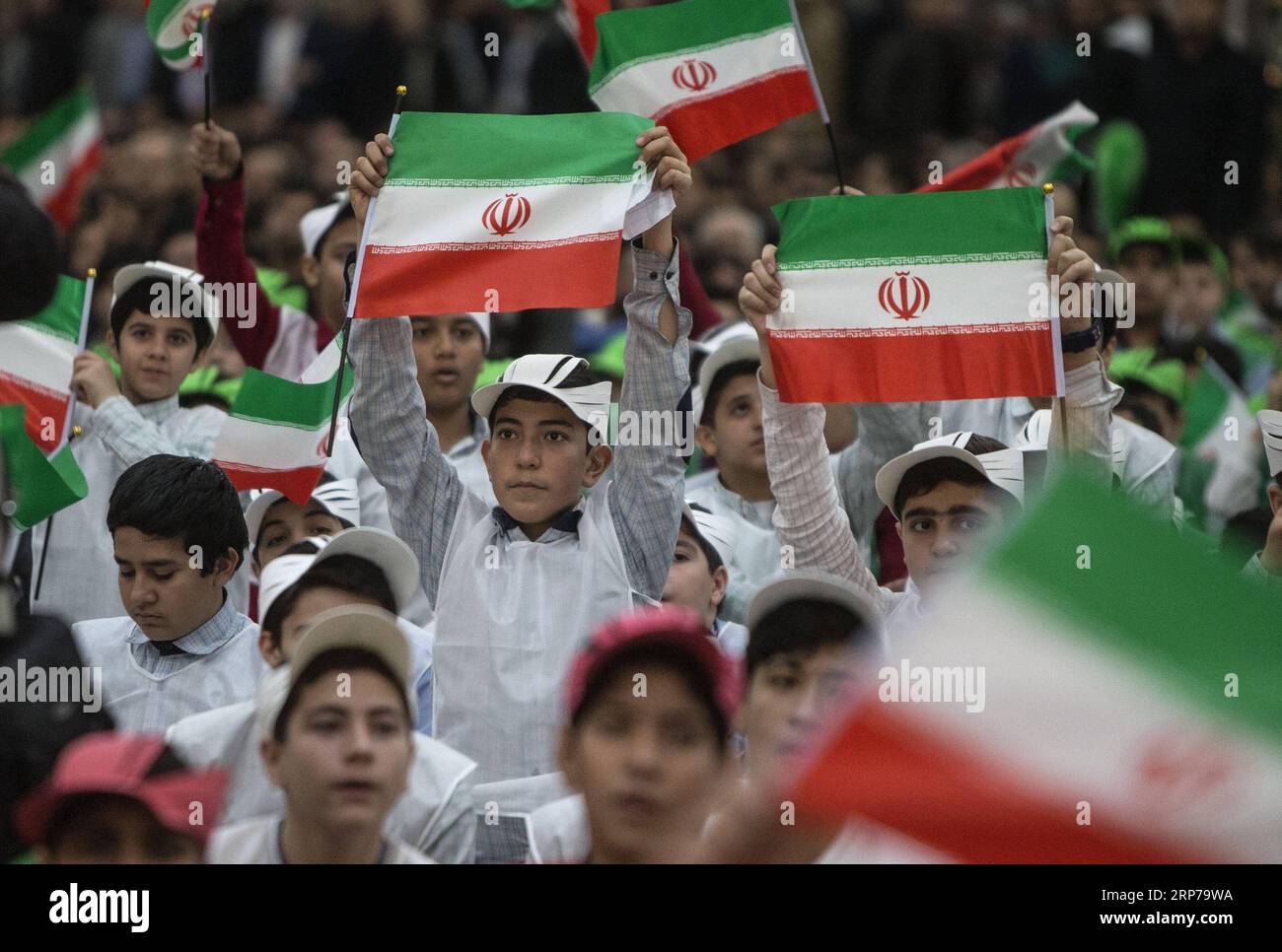 (190201) -- TEHRAN, Feb. 1, 2019 -- Iranian children hold flags of Iran ...