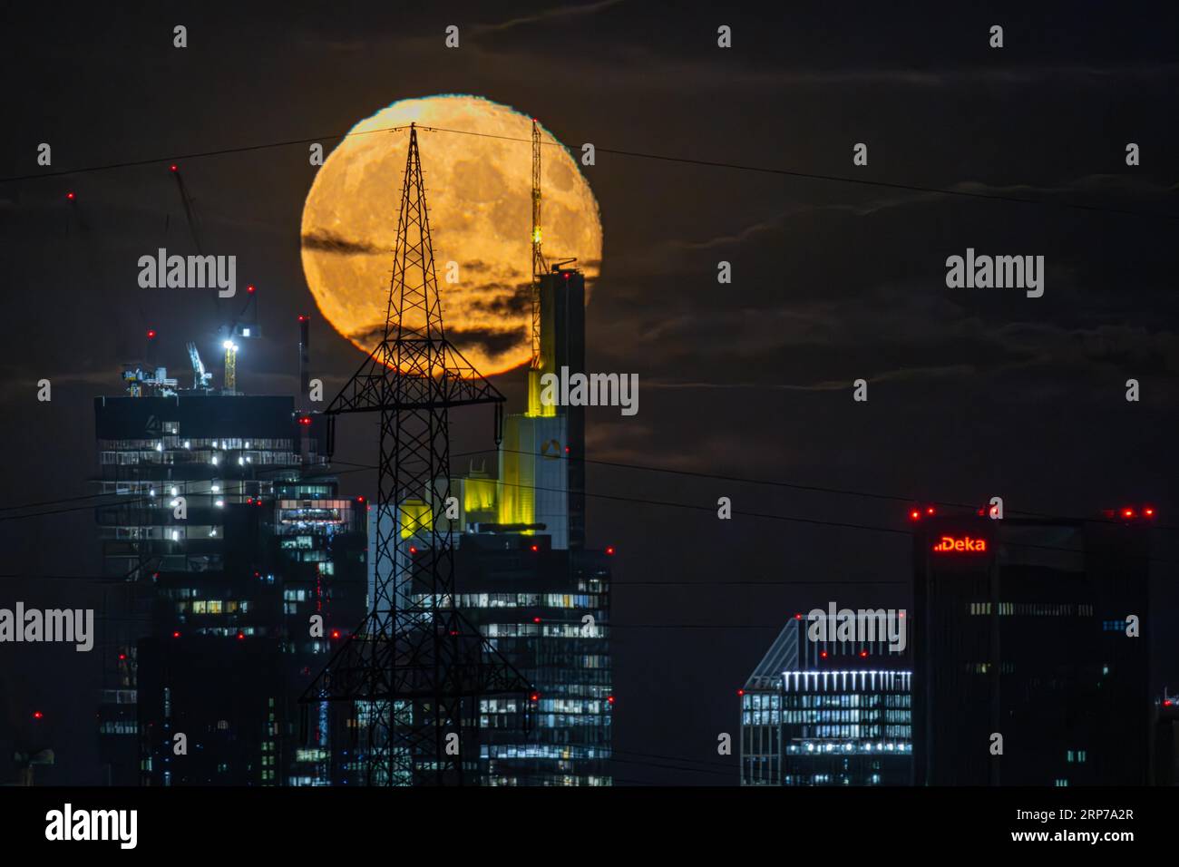 The super full moon rises behind the Frankfurt bank skyline, Frankfurt ...