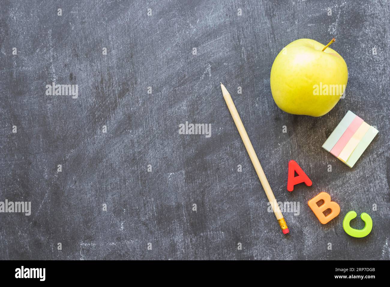 Blackboard with stationery alphabet letters apple Stock Photo - Alamy