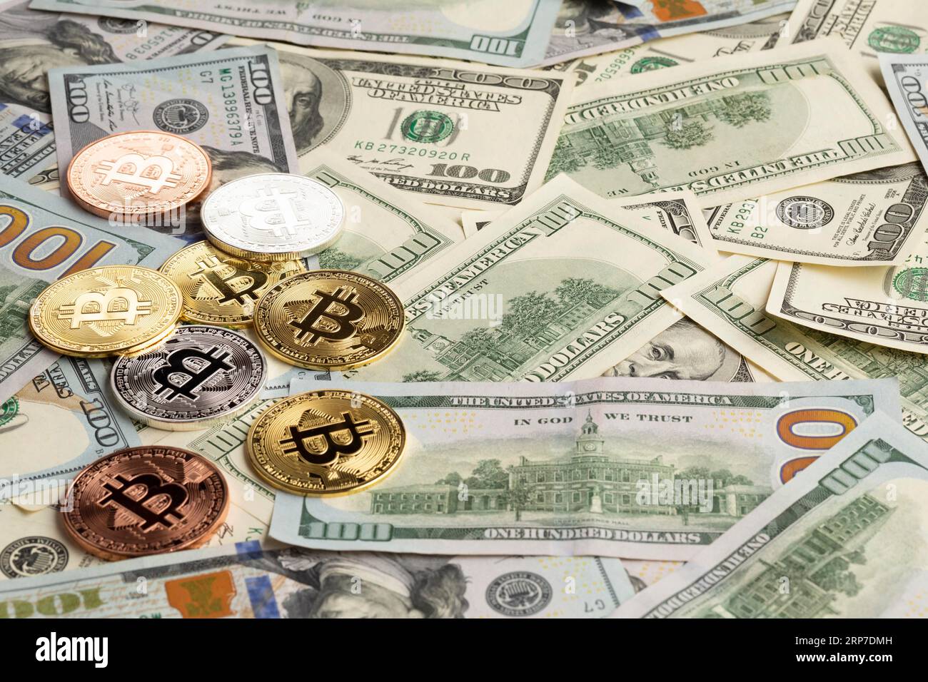 Different colored bitcoin top dollar bills Stock Photo - Alamy