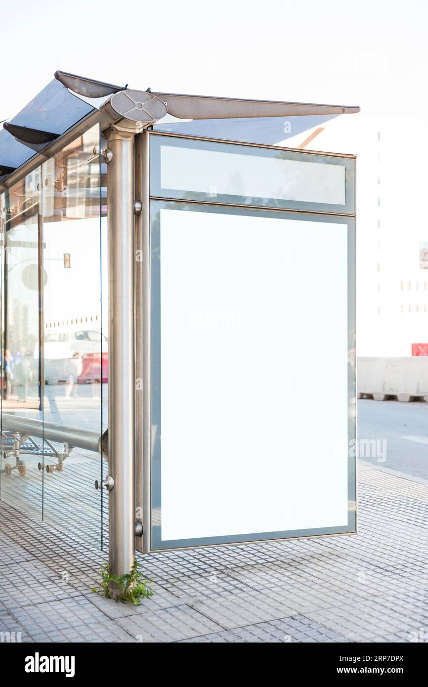 Bus stop with blank billboard Stock Photo - Alamy