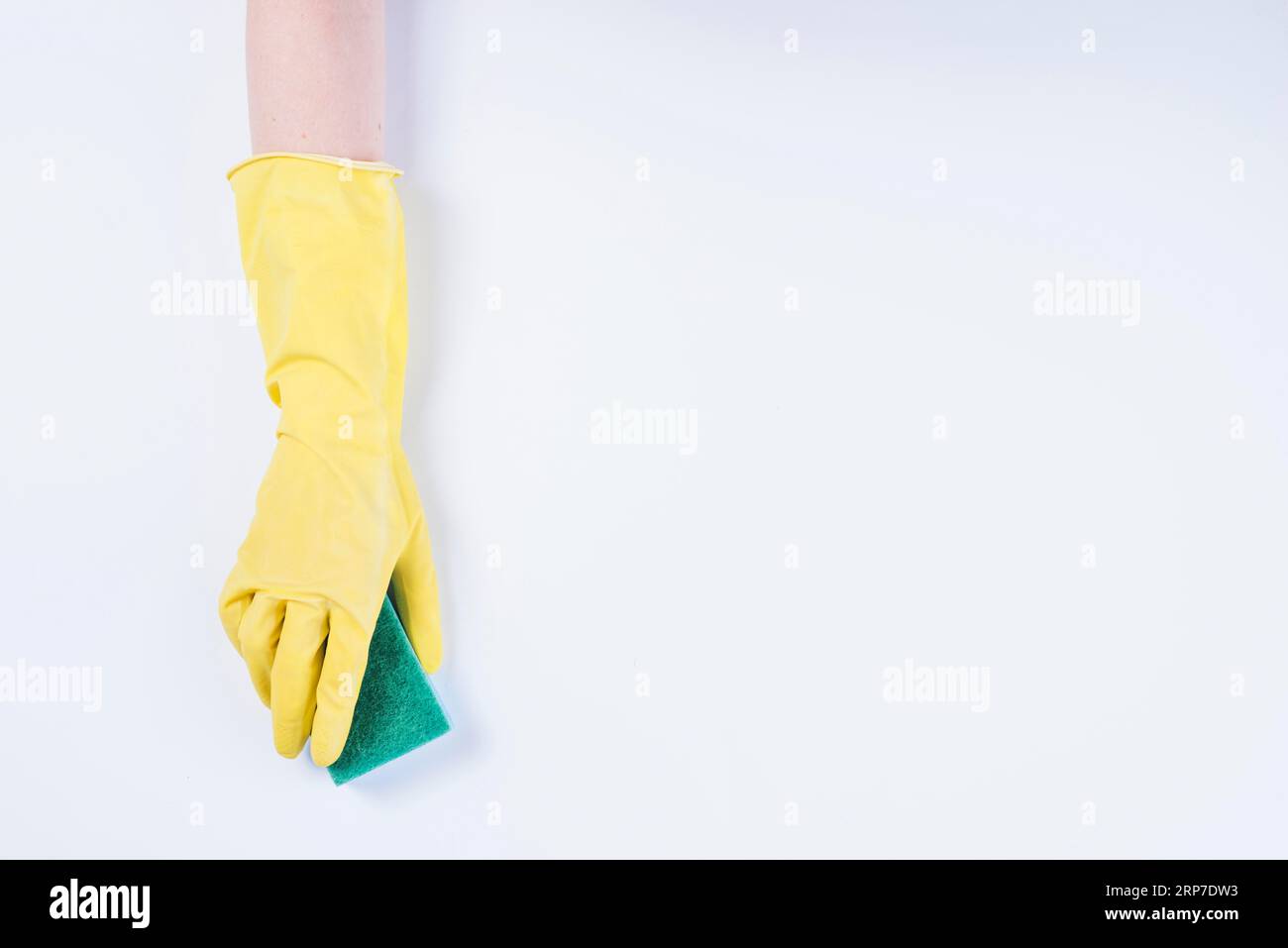Janitor s hand with yellow gloves holding sponge white background Stock ...