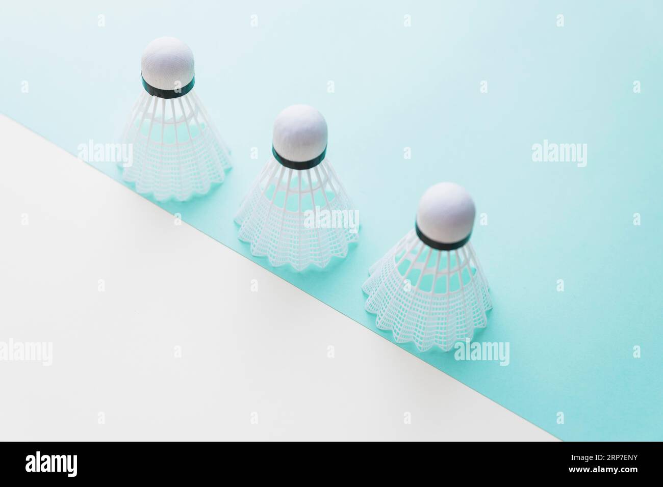 Three white shuttlecock dual background Stock Photo - Alamy