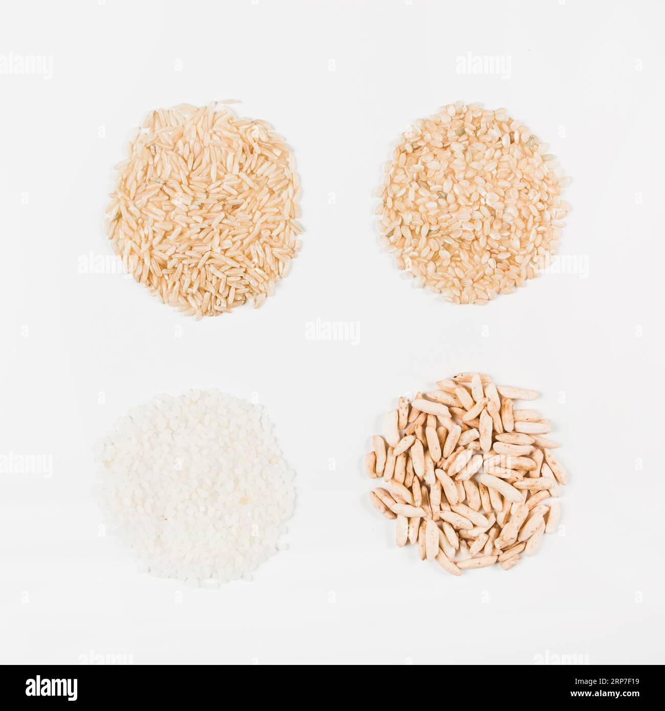 Uncooked white brown puffed rice isolated white backdrop Stock Photo ...