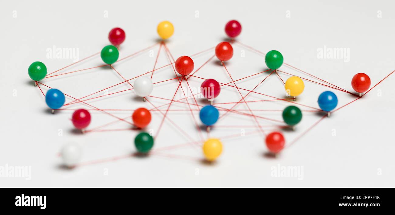 Colourful pushpins with thread route map Stock Photo - Alamy