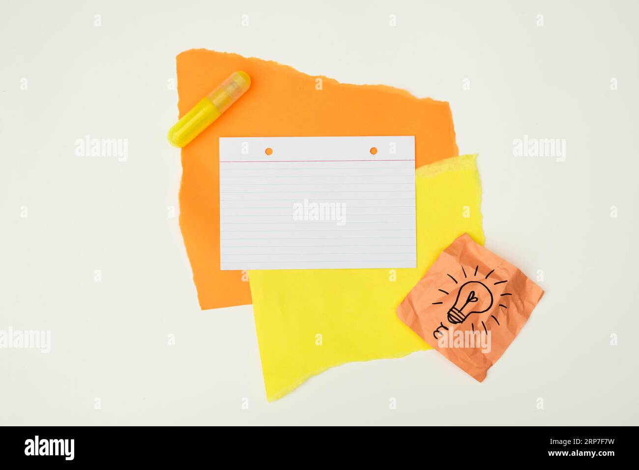 Color paper glue with hand drawn light bulb note paper isolated white ...