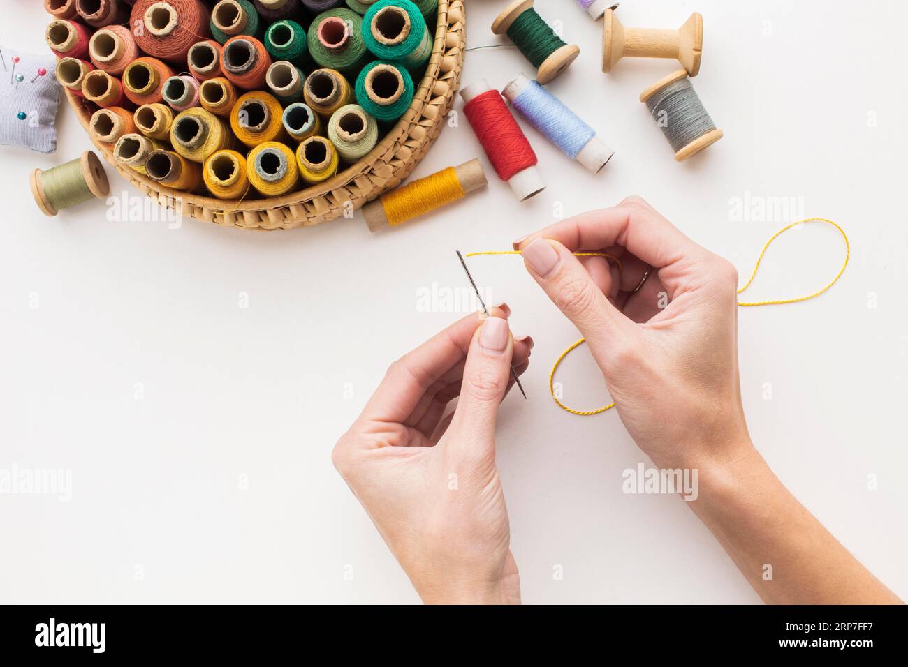 Hands working with needle sewing thread Stock Photo - Alamy