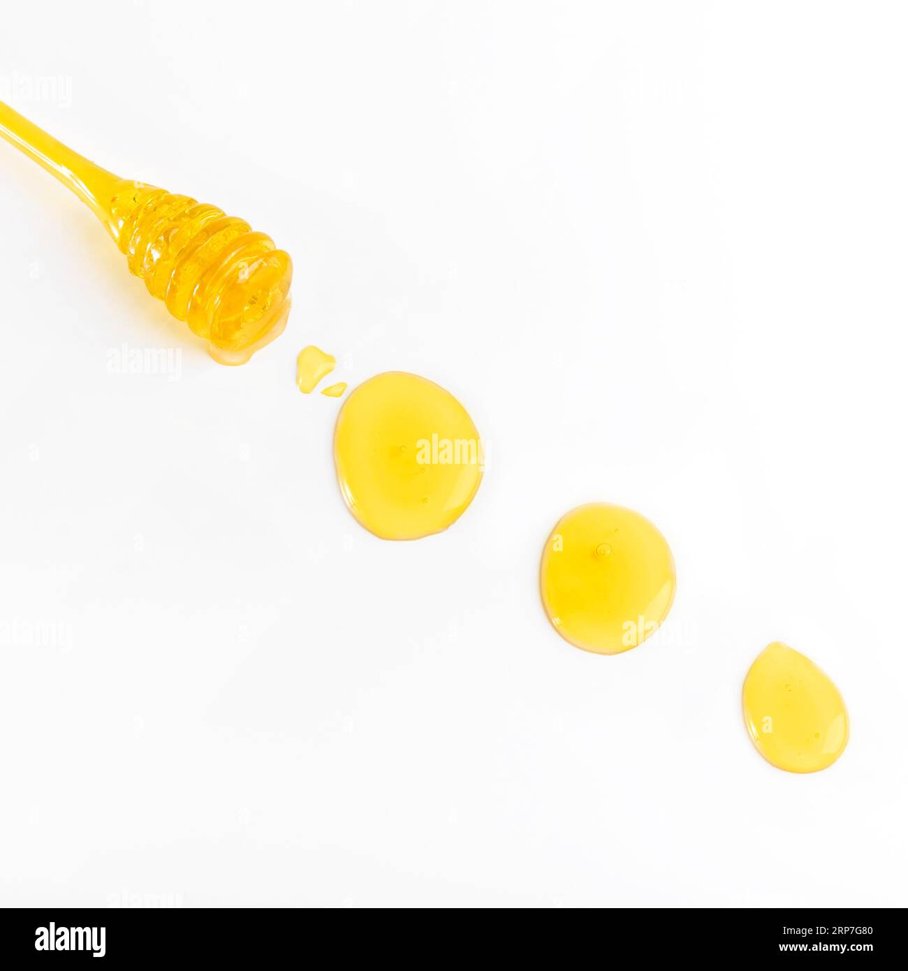 Honey dipper white background Stock Photo - Alamy