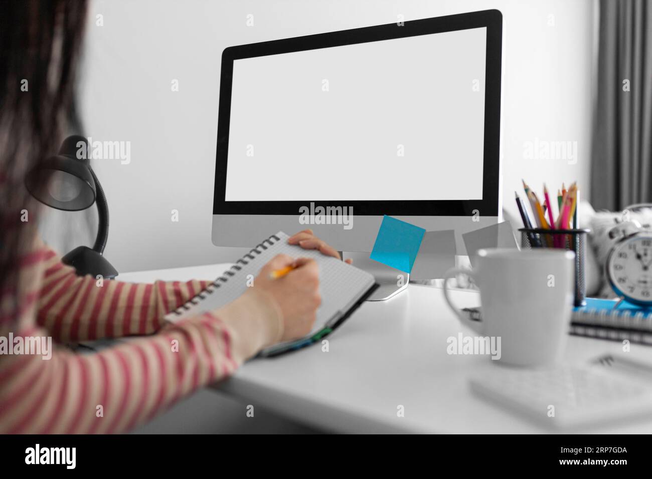 Student taking notes Stock Photo - Alamy