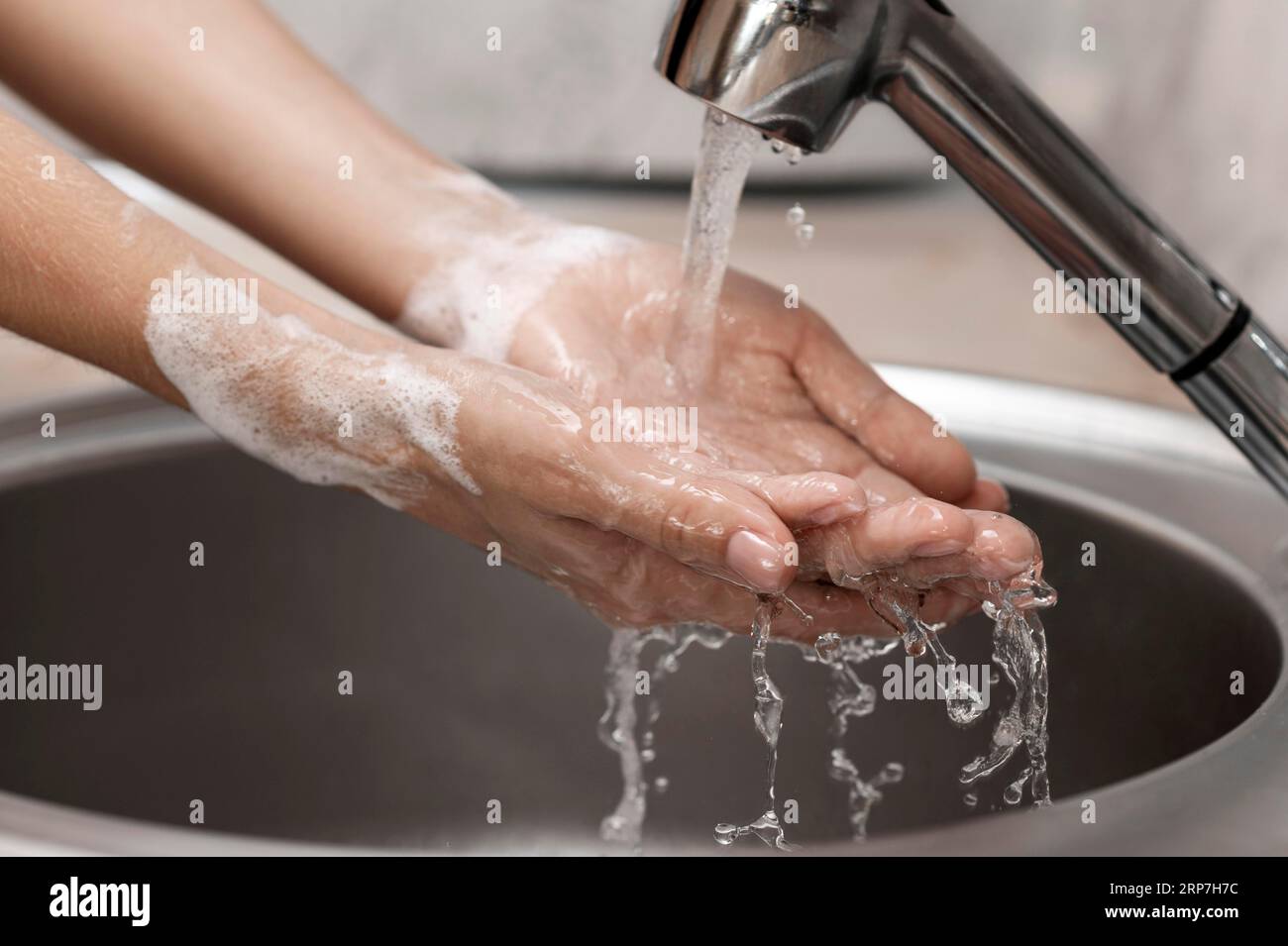 Person washing hands sink Stock Photo - Alamy