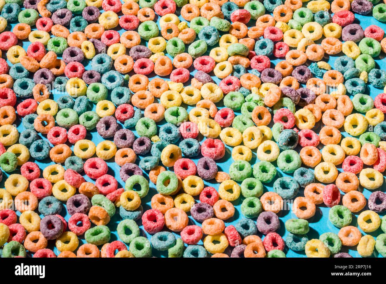 Backgrounds made with colorful cereal loop rings Stock Photo - Alamy