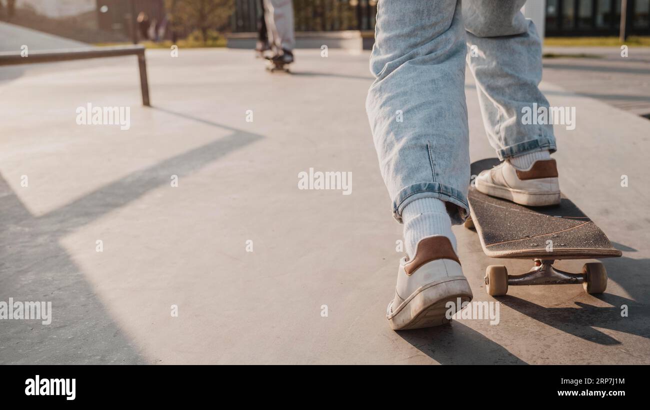 Back view teenager with skateboard copy space skatepark Stock Photo - Alamy