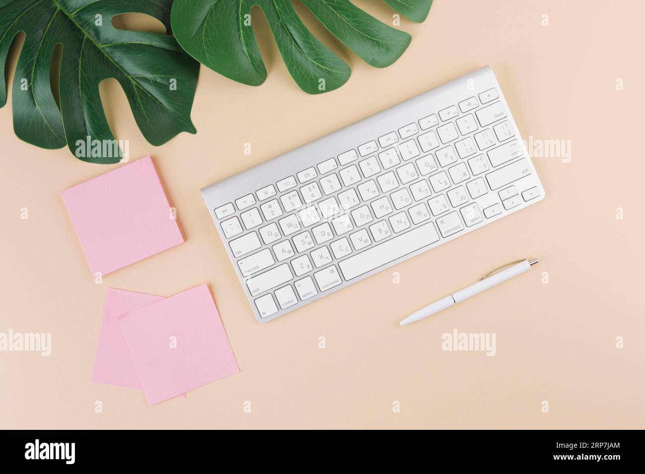 Keyboard with stickers pen yellow table Stock Photo - Alamy