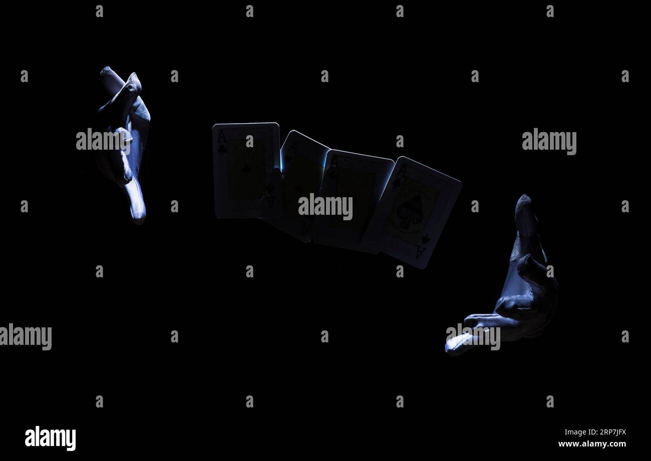 Magician s hand performing trick with playing card Stock Photo - Alamy