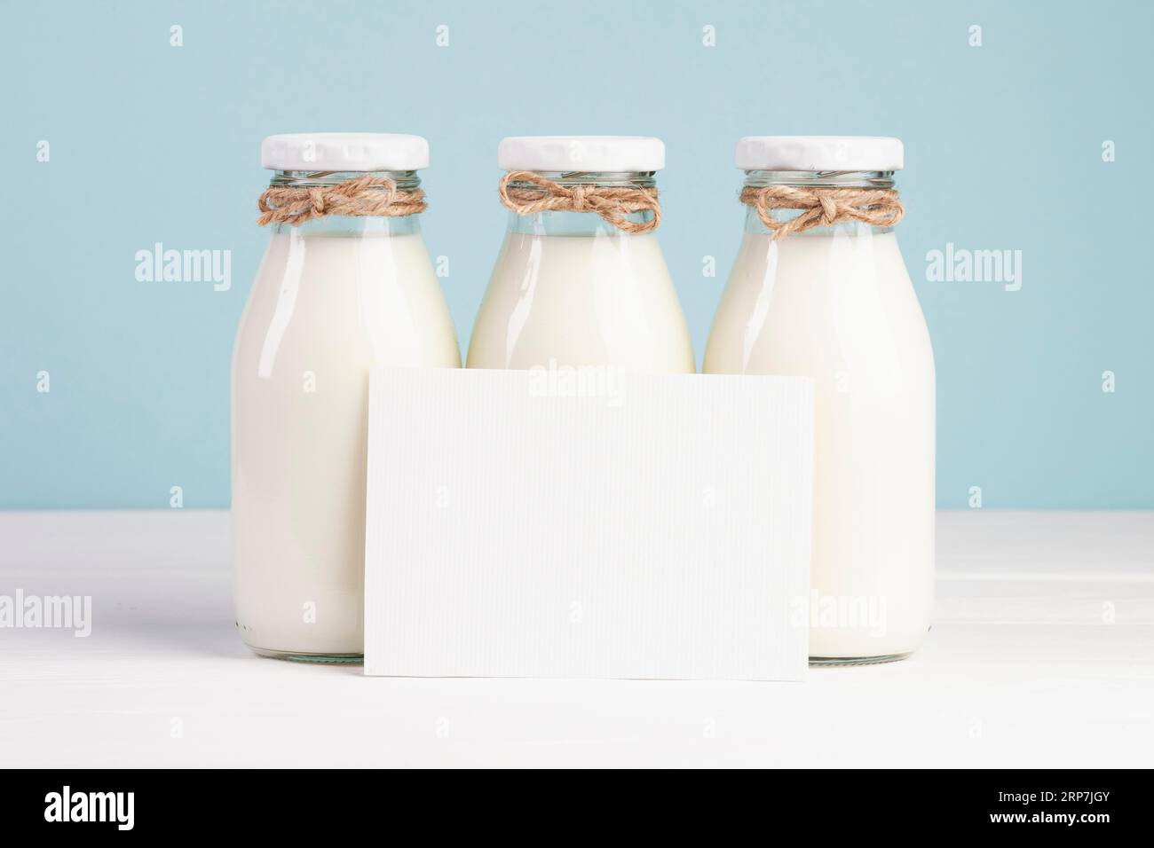 Milk bottles copy space card Stock Photo - Alamy