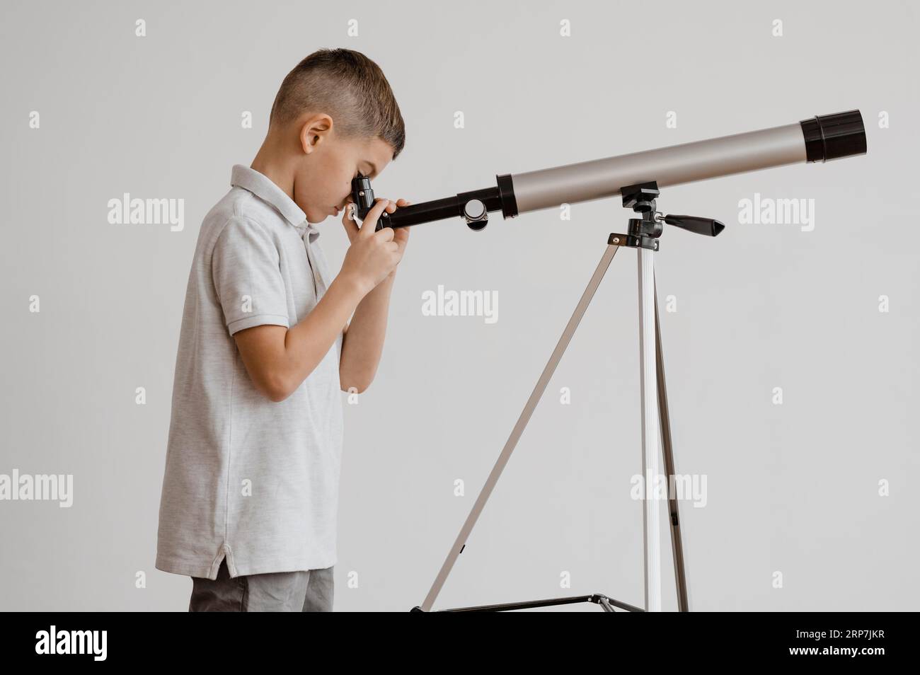 Boy using telescope hi-res stock photography and images - Alamy