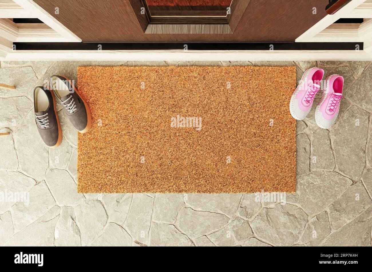 Overhead of blank doormat with man and woman shoes on the porch at the ...