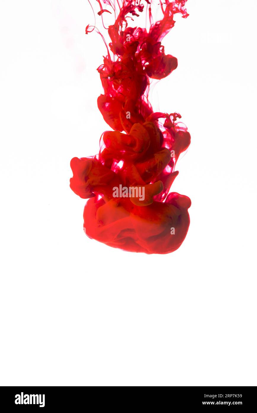 Vivid red droplet ink Stock Photo - Alamy