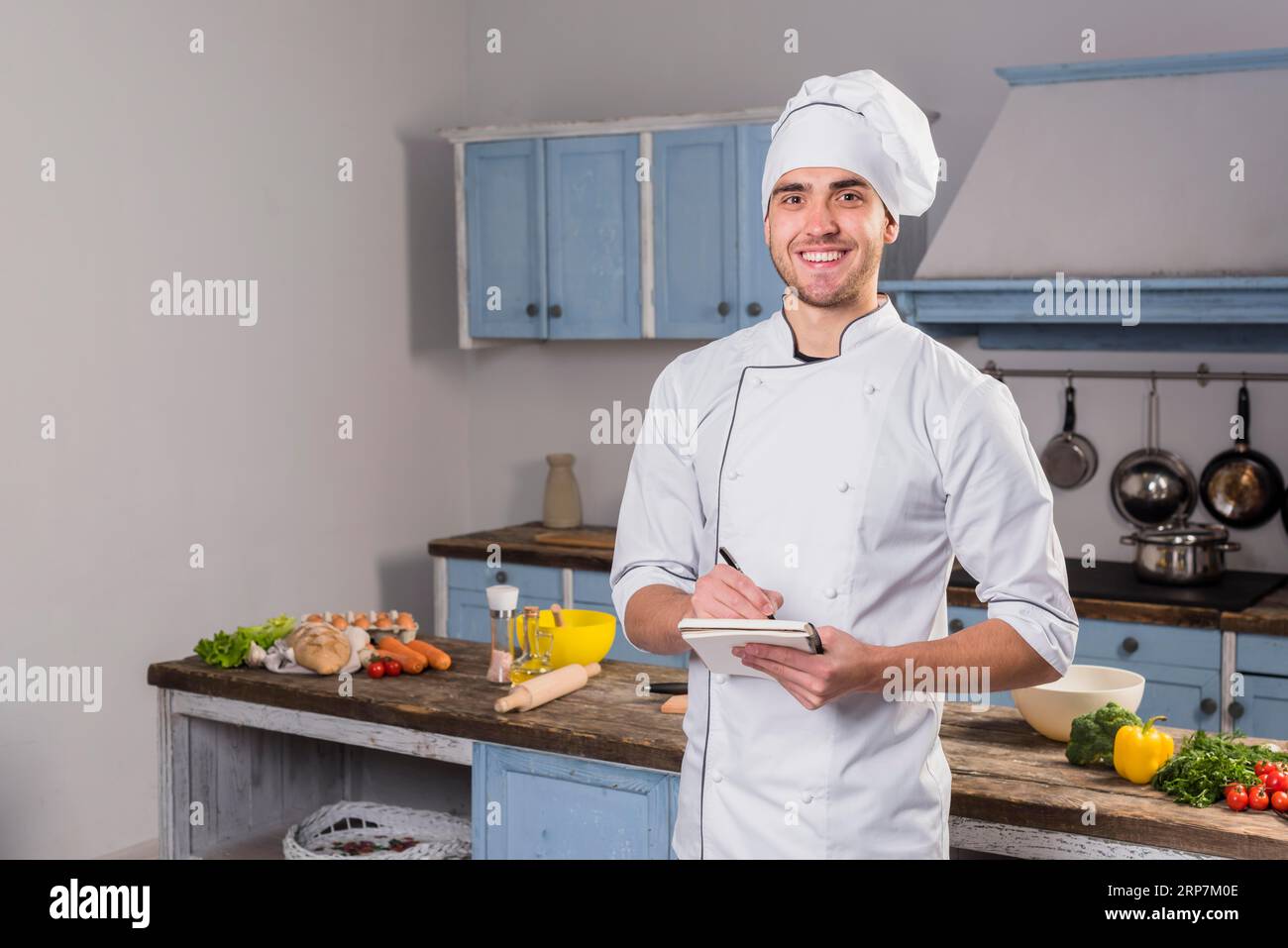 Chef kitchen taking notes Stock Photo - Alamy
