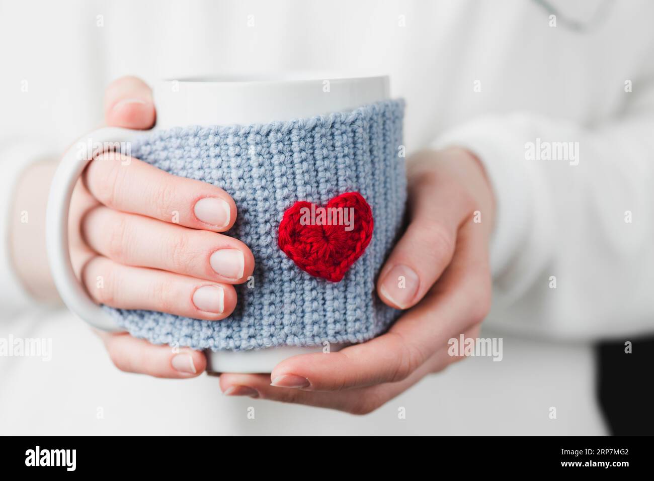 Crop hands with pretty mug Stock Photo - Alamy