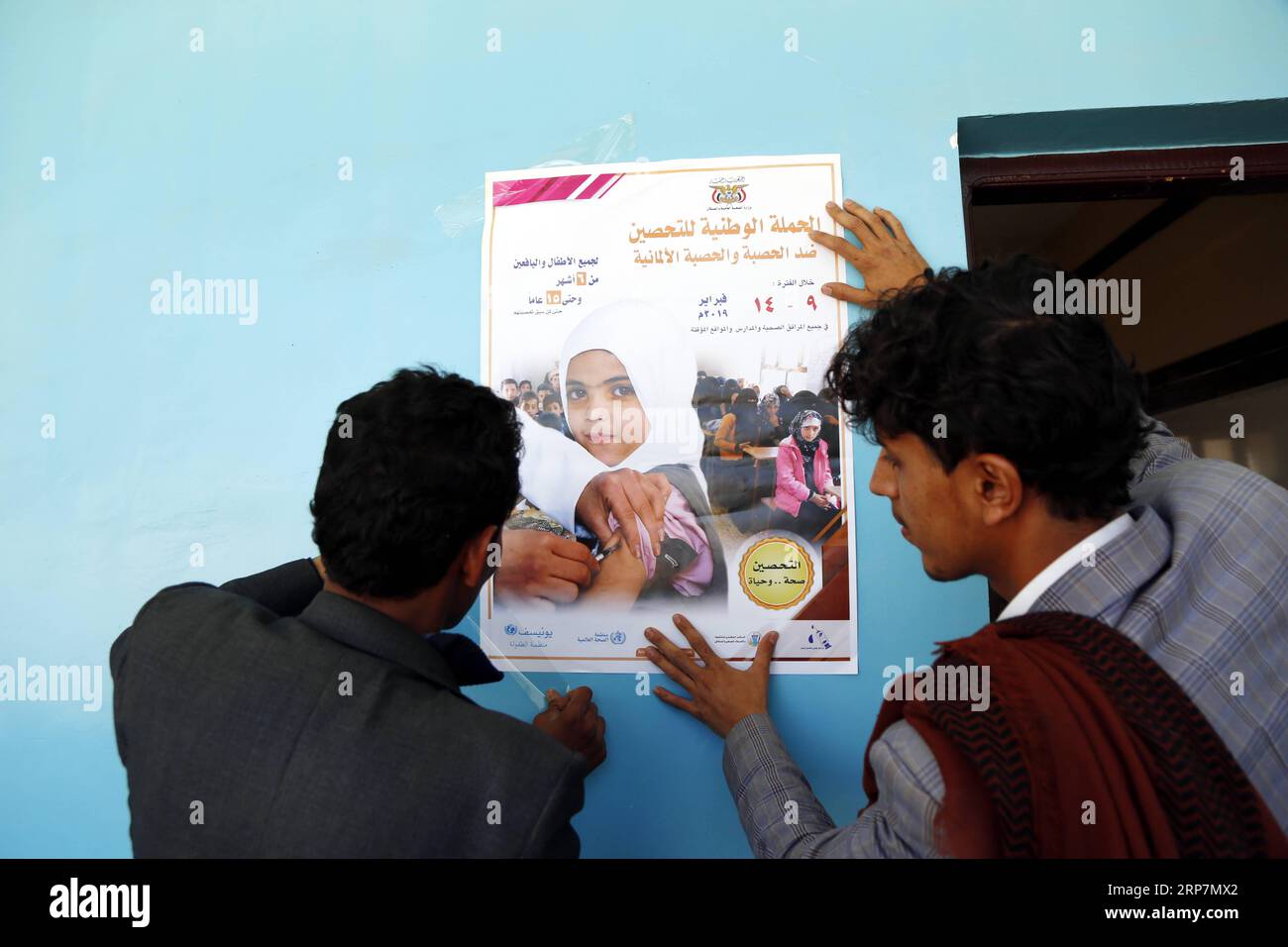 (190209) -- SANAA, Feb. 9, 2019 -- Workers post an awareness poster ...