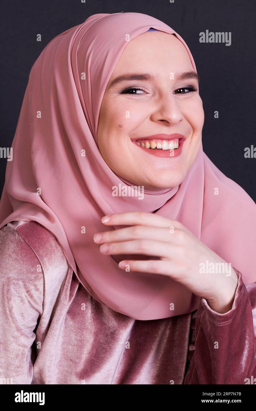 Front view laughing woman black backdrop Stock Photo - Alamy