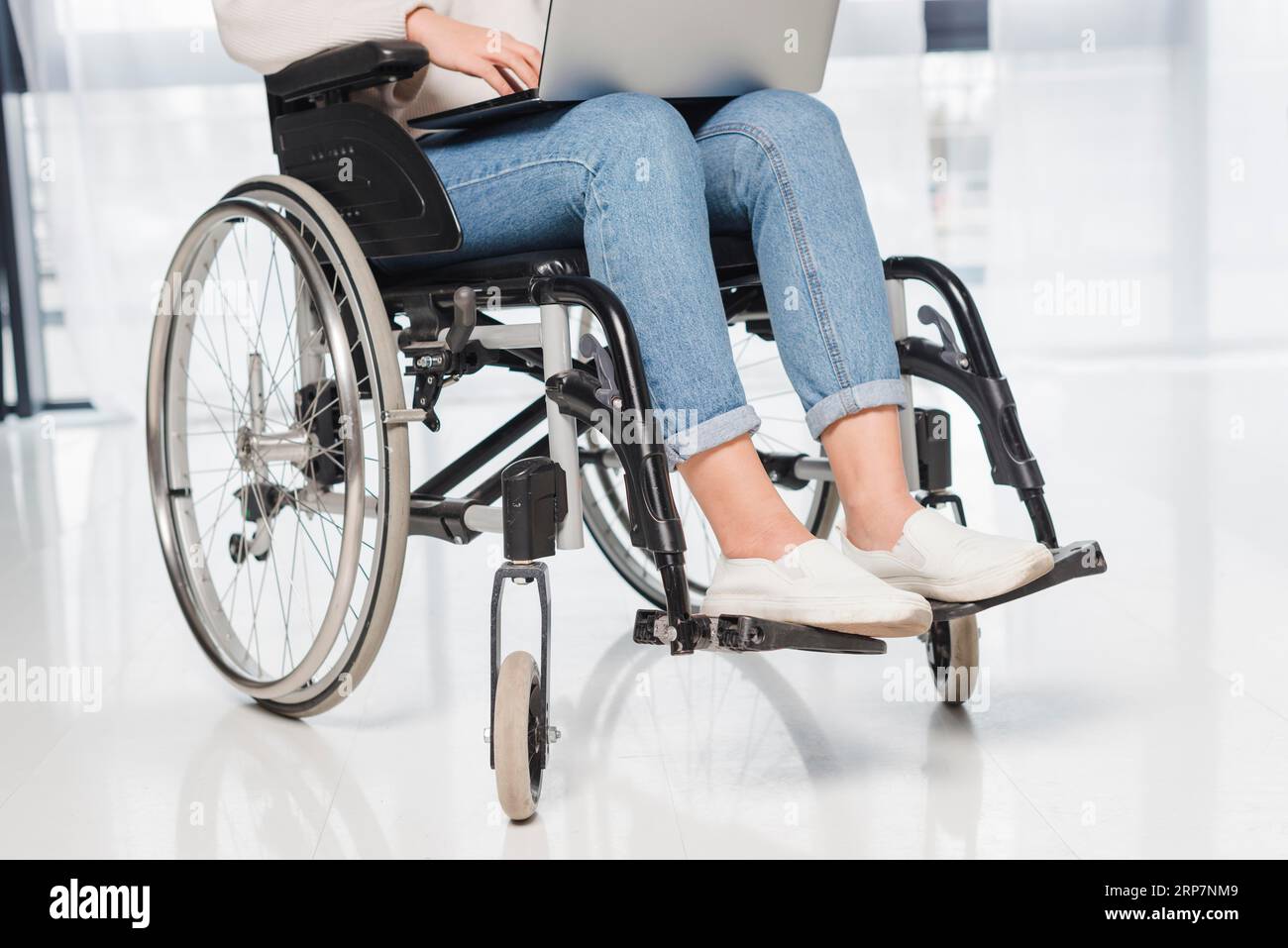 Low section disabled woman sitting wheelchair using digital tablet ...