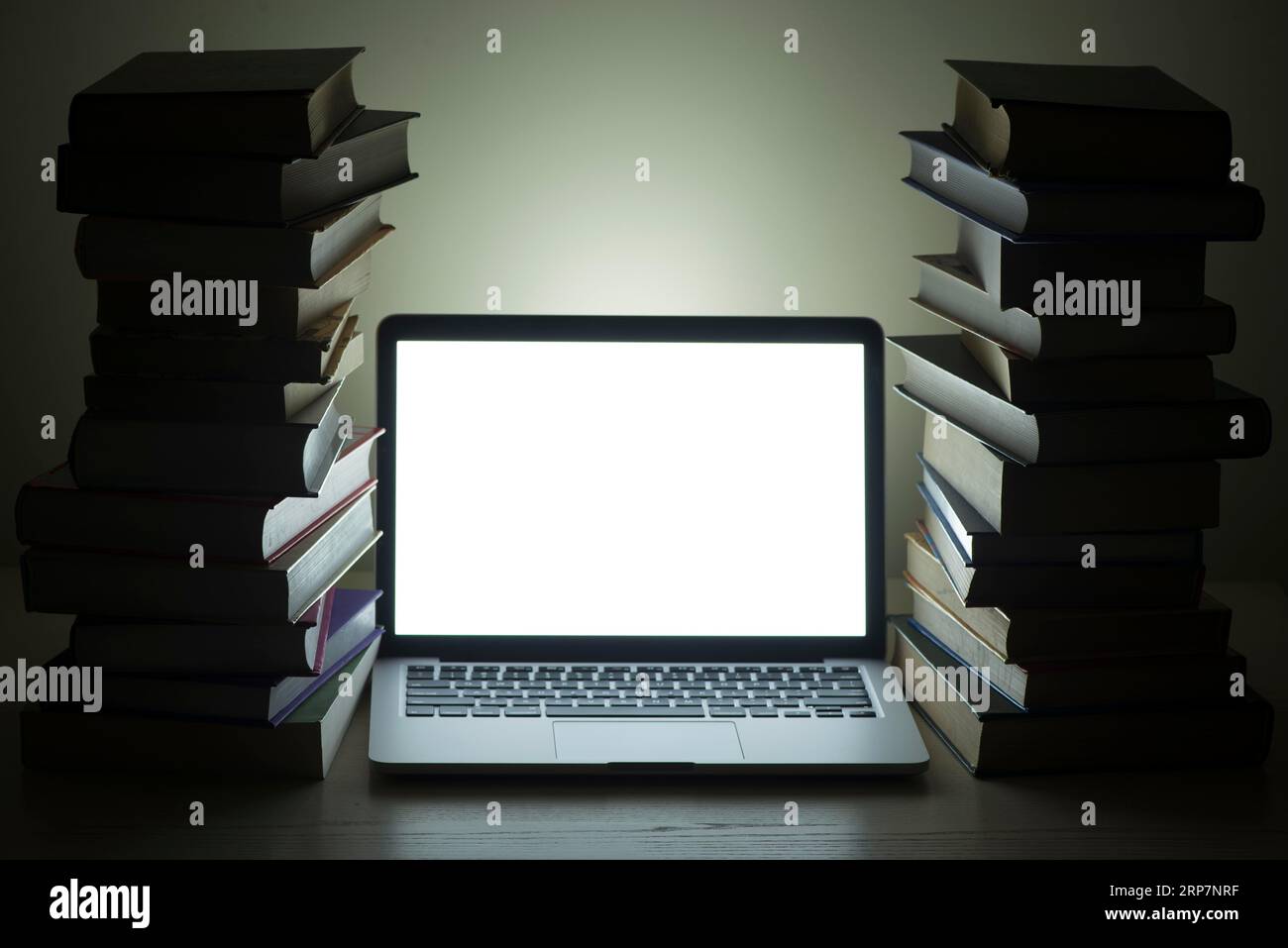 Computer on stacked books hi-res stock photography and images - Alamy