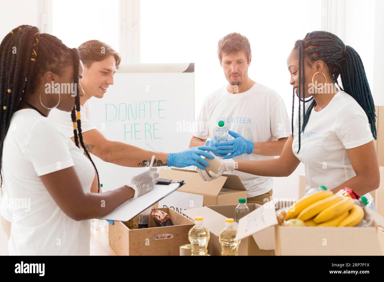 People taking care together donations Stock Photo - Alamy