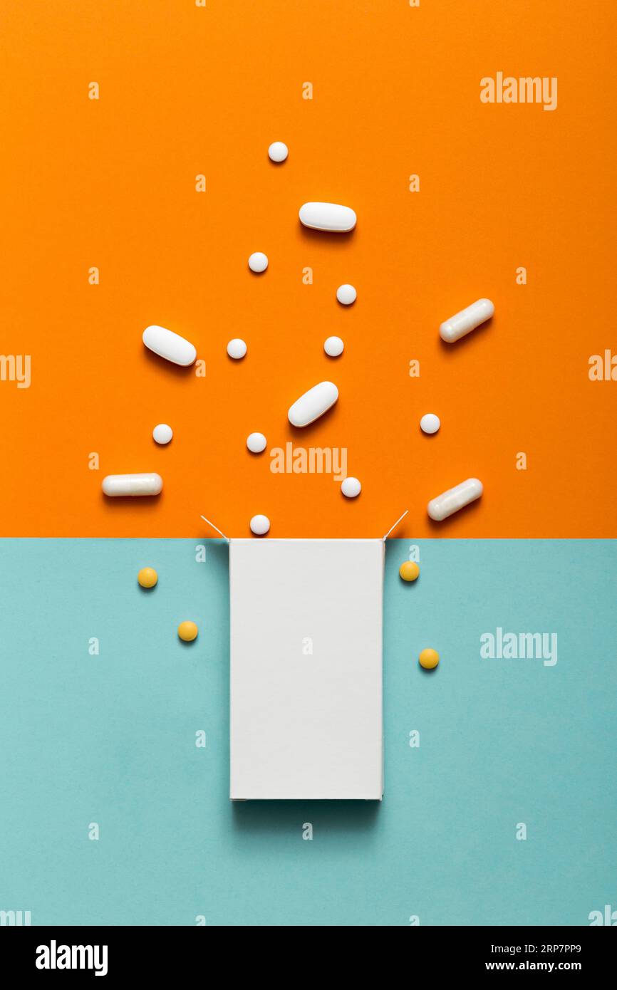 Top view pills coming out box Stock Photo - Alamy