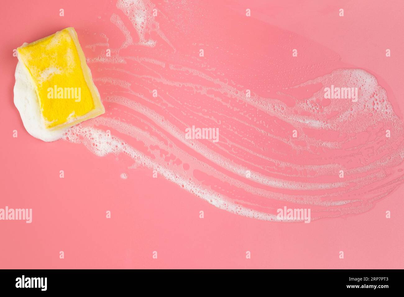 Top view sponge with foam pink background Stock Photo - Alamy