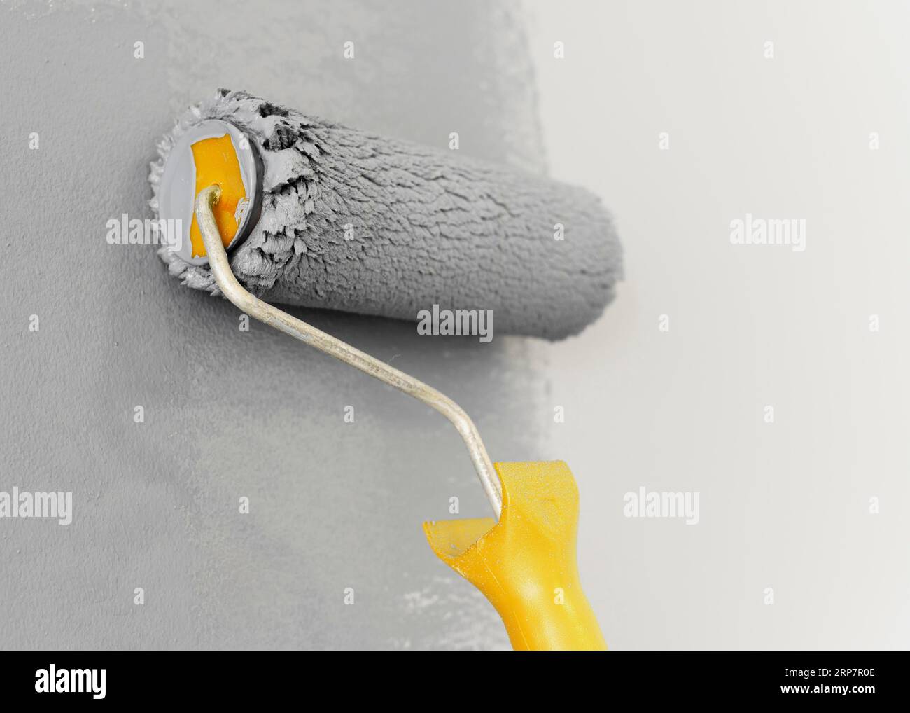 Wall painting with roller Stock Photo - Alamy