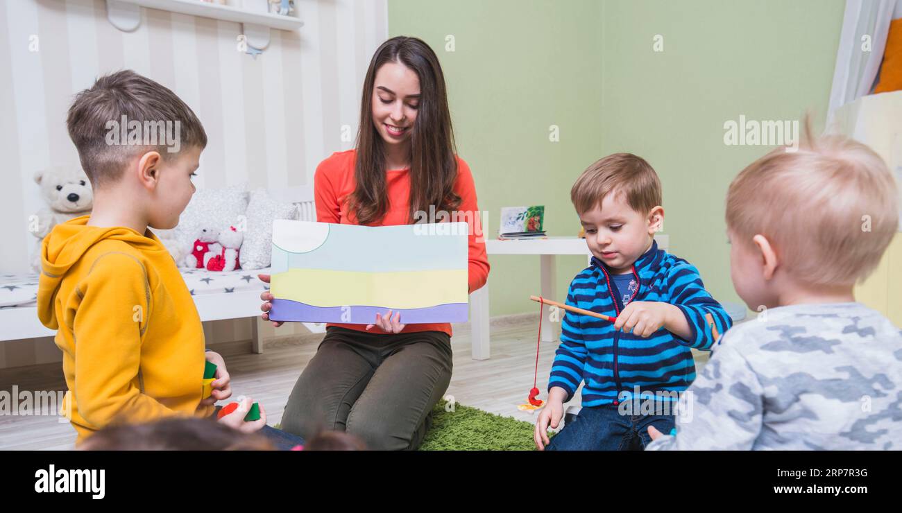 Woman showing colored picture Stock Photo - Alamy