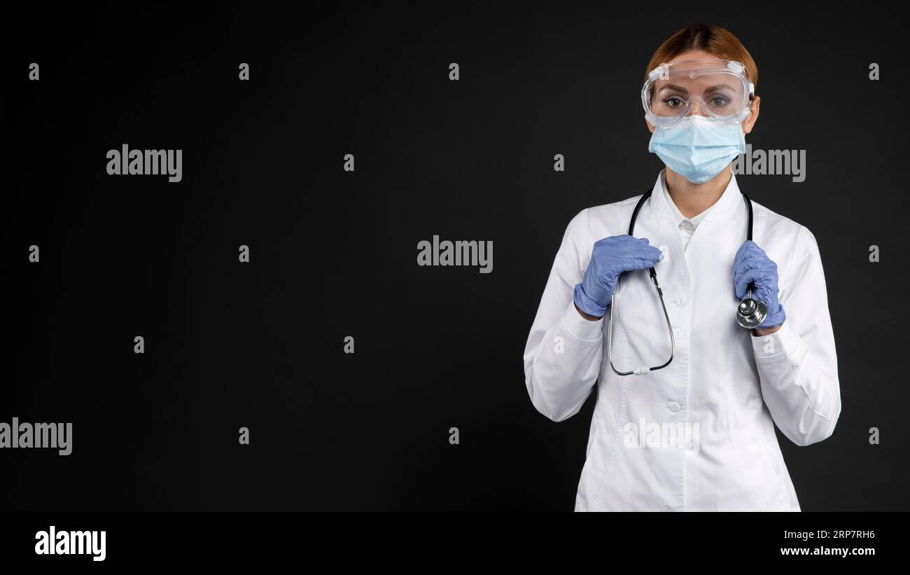 Female doctor wearing protective medical equipment Stock Photo - Alamy