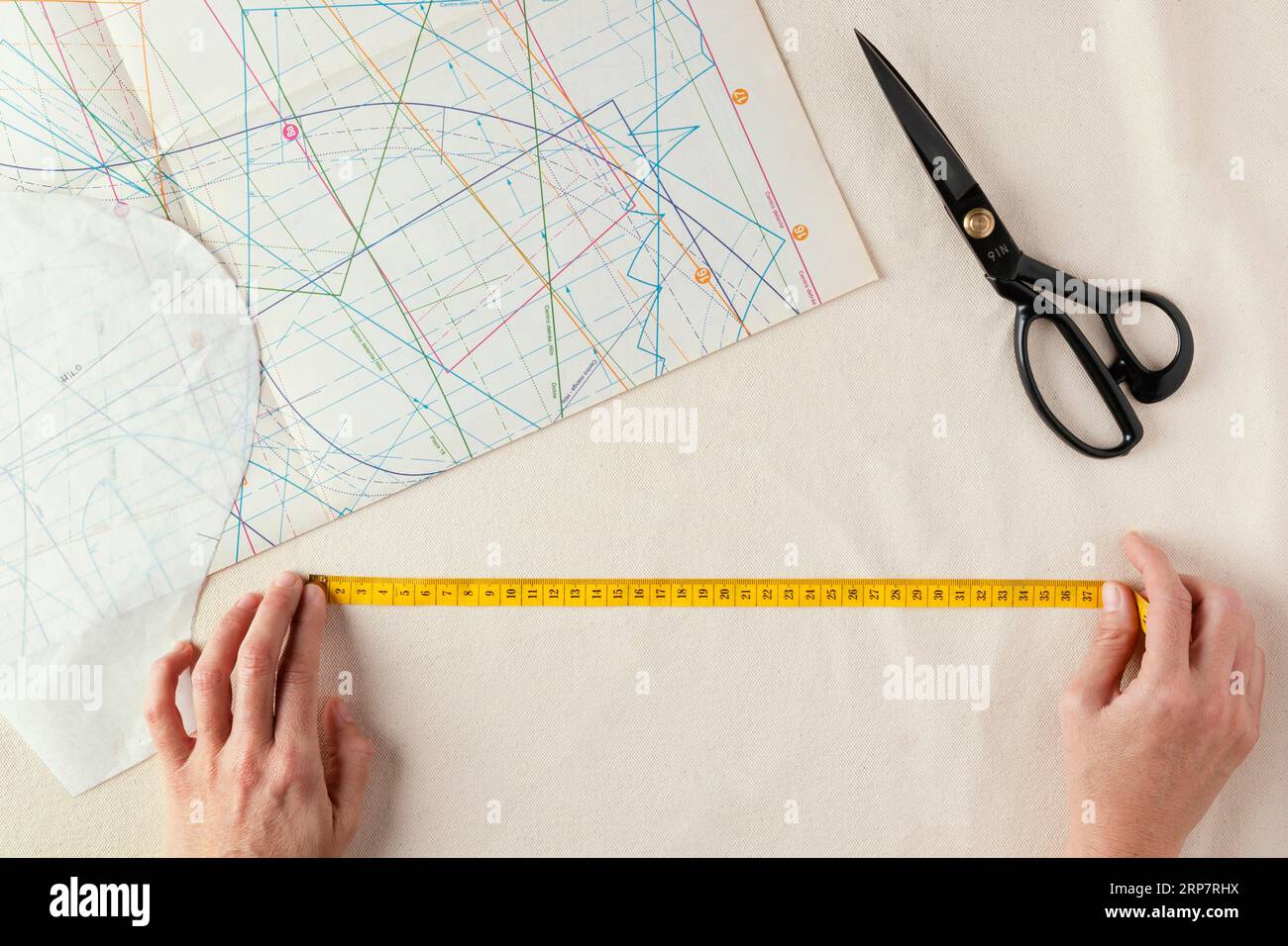 Close up tailor using measuring tape Stock Photo - Alamy