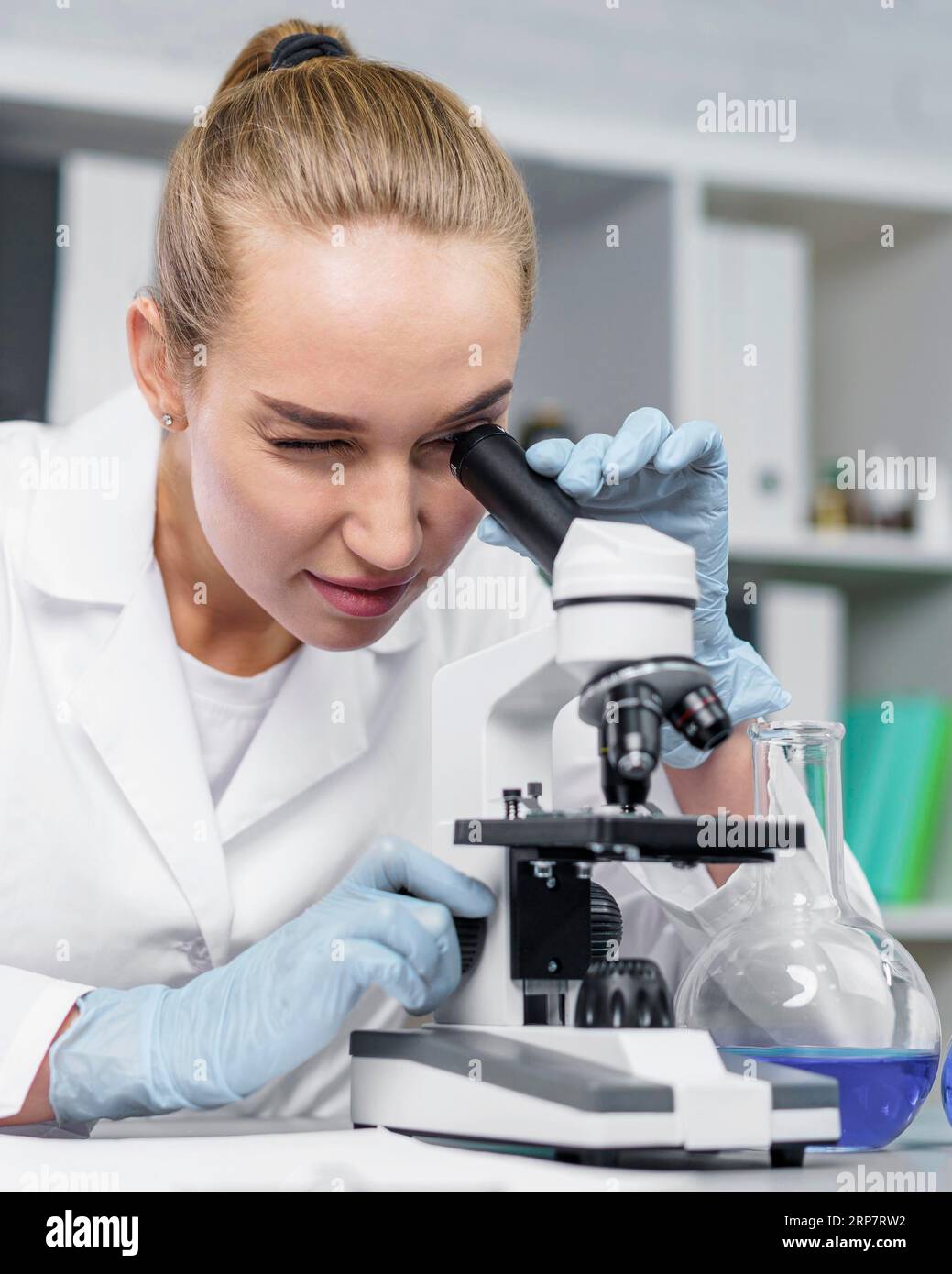 Front view female researcher laboratory with microscope Stock Photo - Alamy