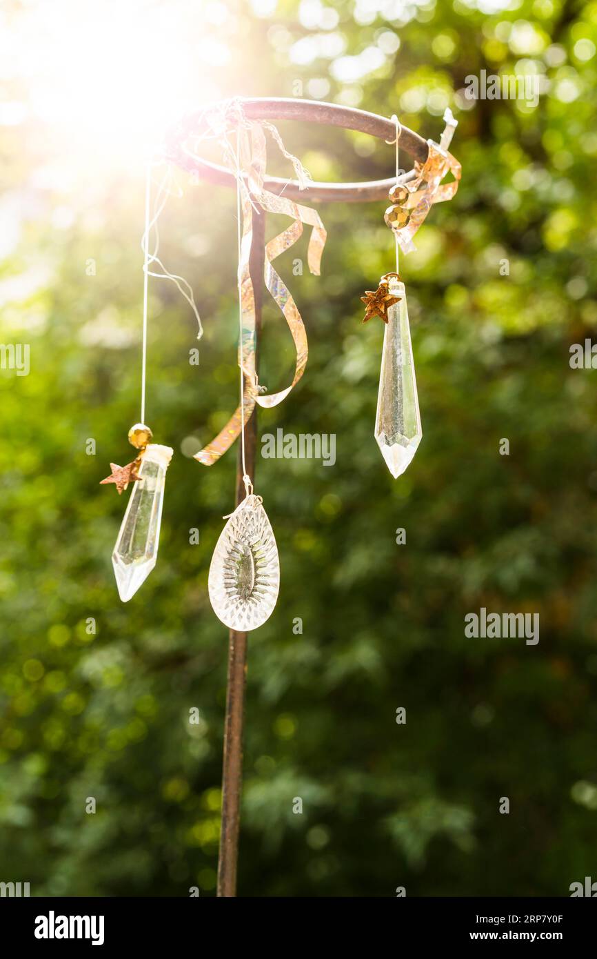 White quartz crystals hanging on strings over nature background Stock ...