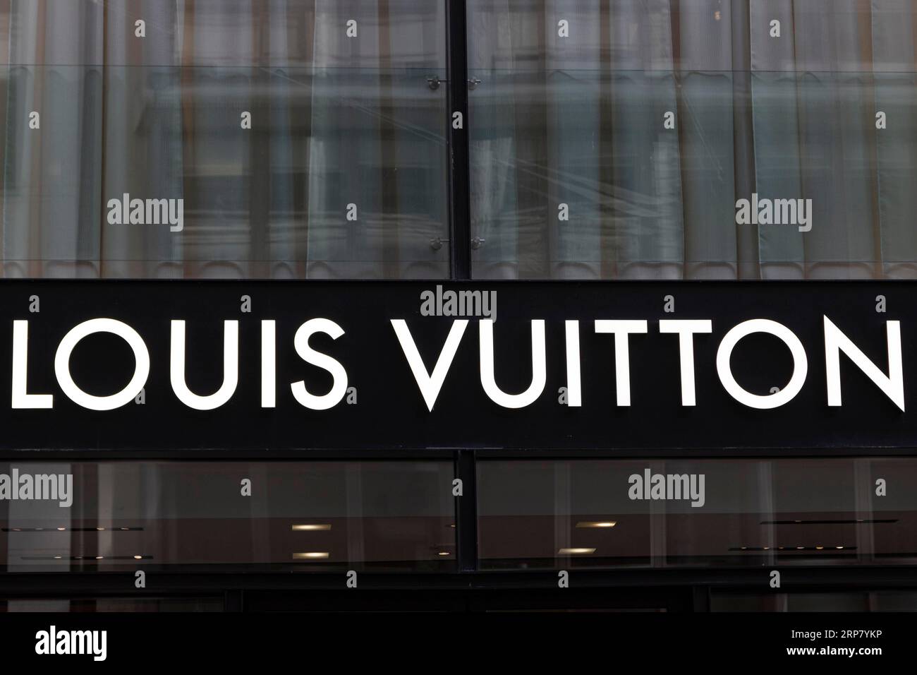 Close-up, logo of the French luxury fashion brand Louis Vuitton on a ...