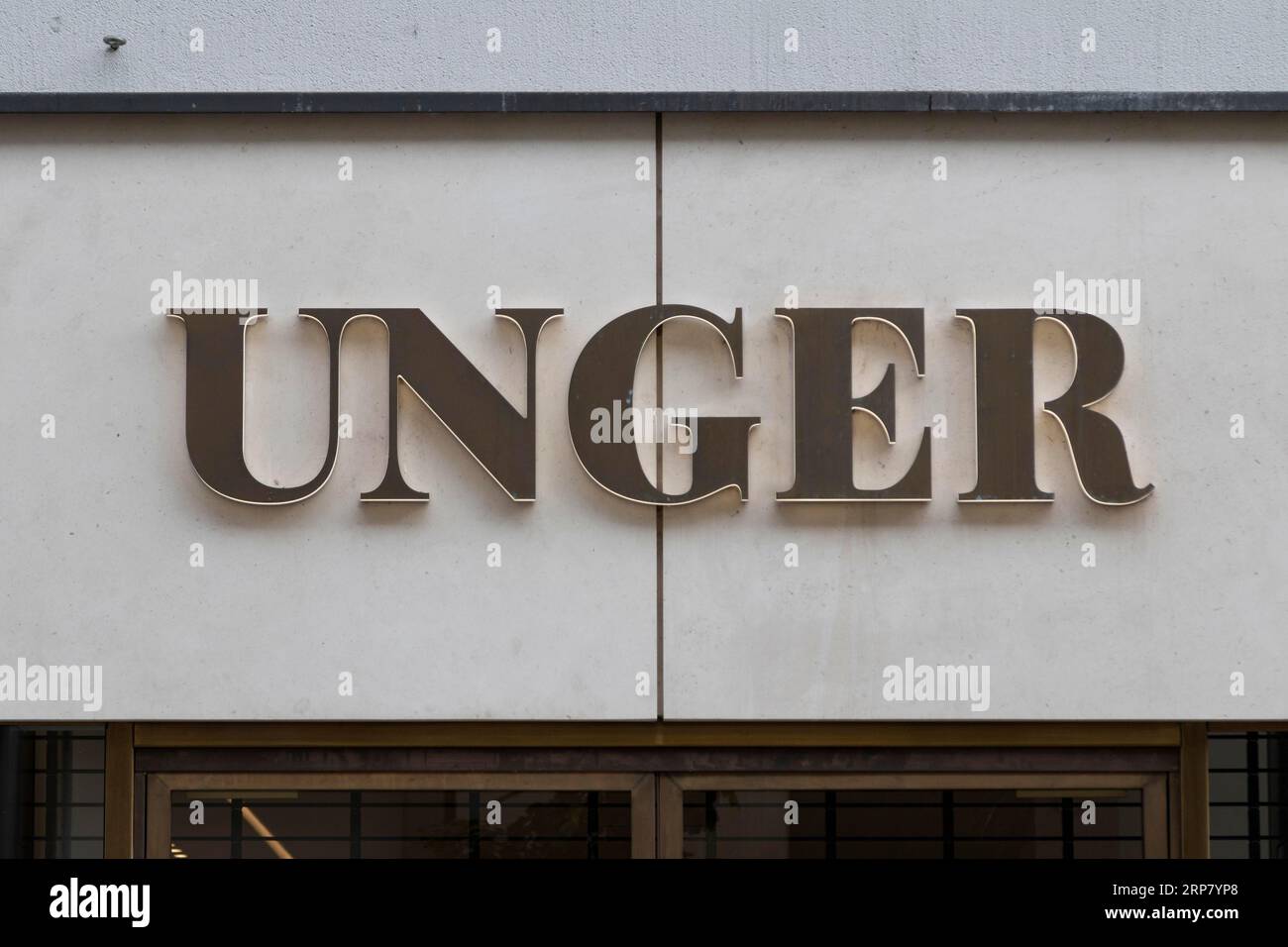 Close-up, logo of the Hamburg luxury fashion brand Unger on a boutique ...