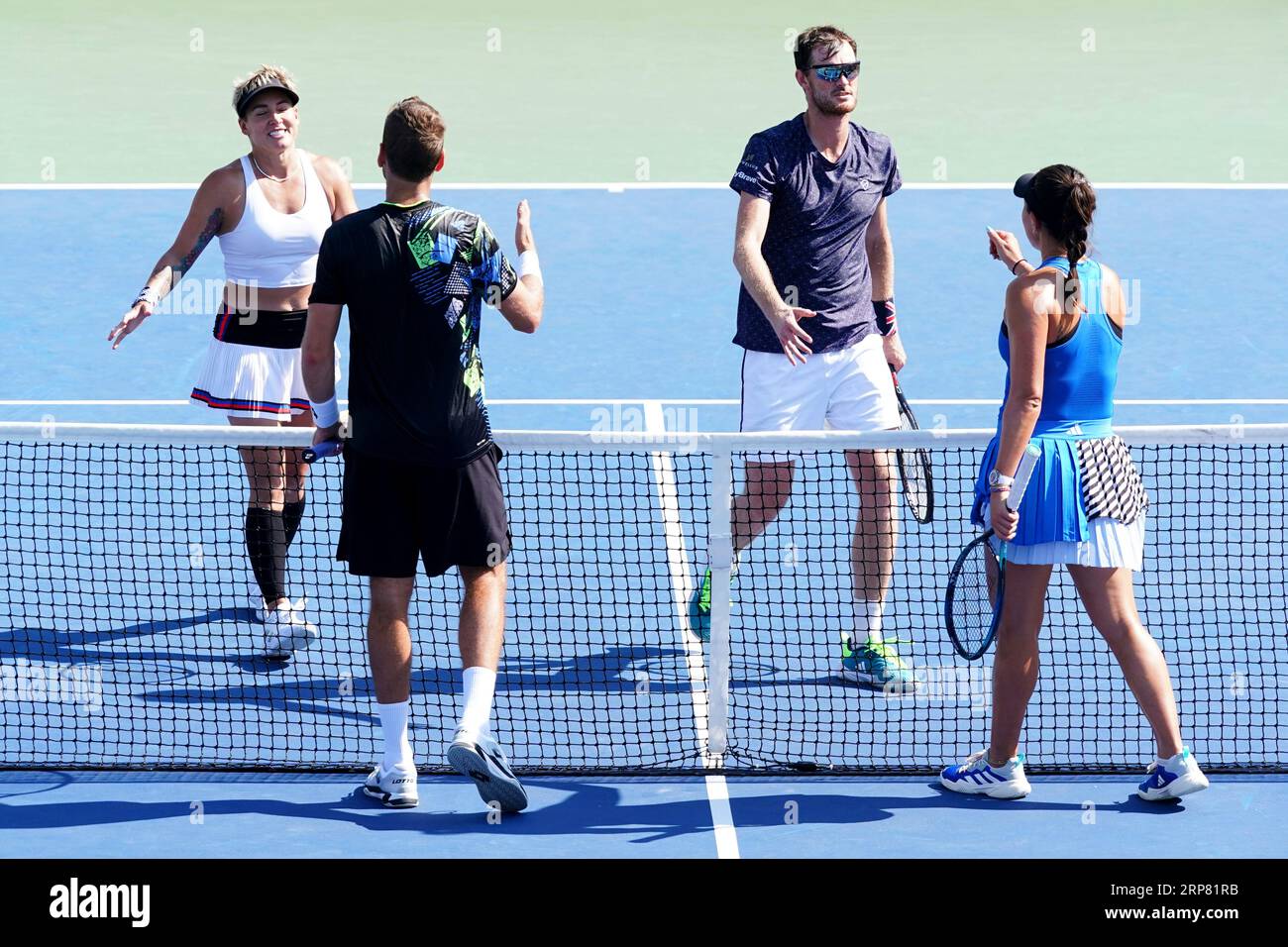 Bethanie Mattek-Sands and Andy Murray shake hands with Austin Krajicek and Jessica Pegula at the ...