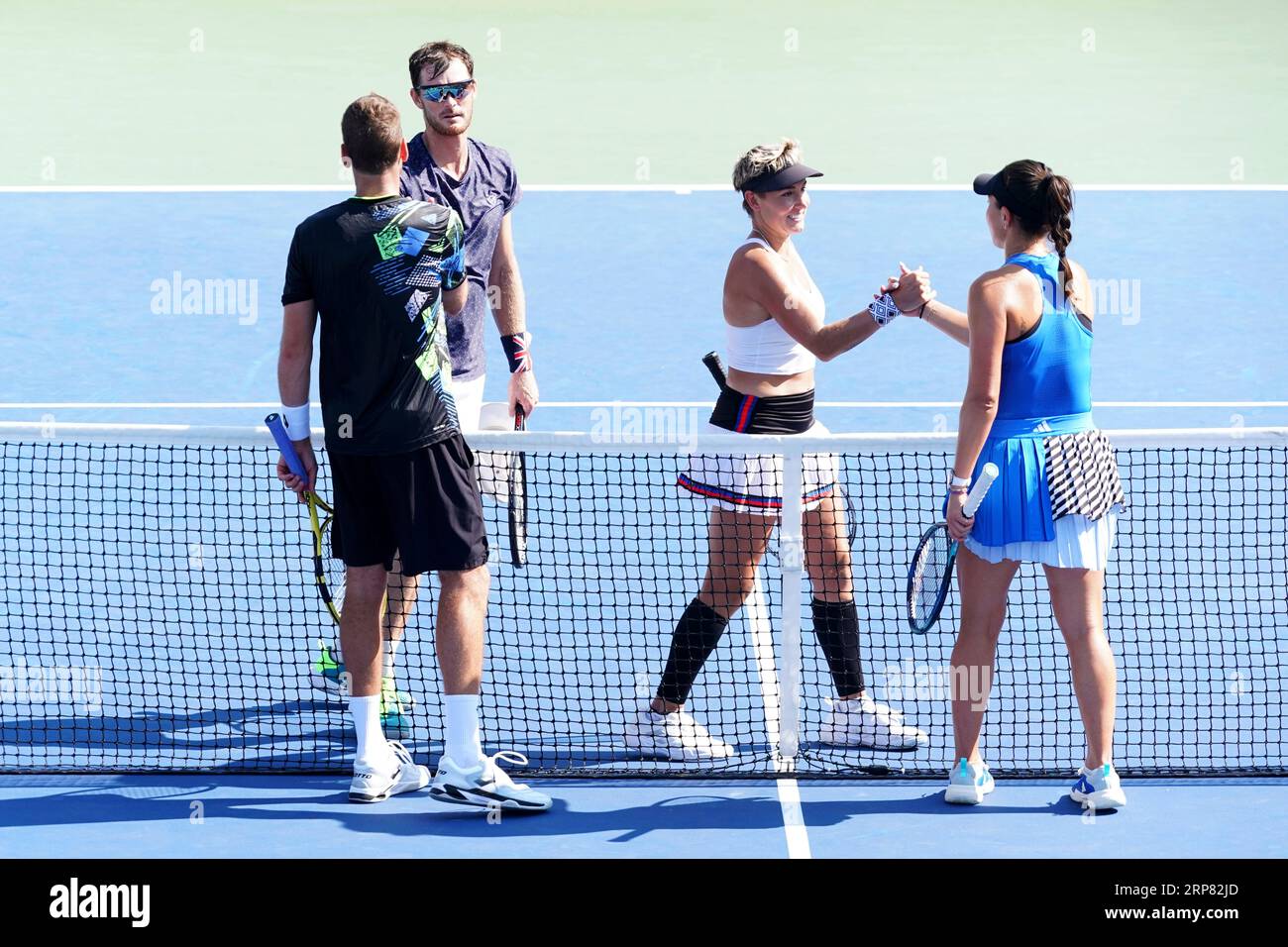 Bethanie Mattek-Sands and Jamie Murray shake hands with Austin Krajicek and Jessica Pegula at ...