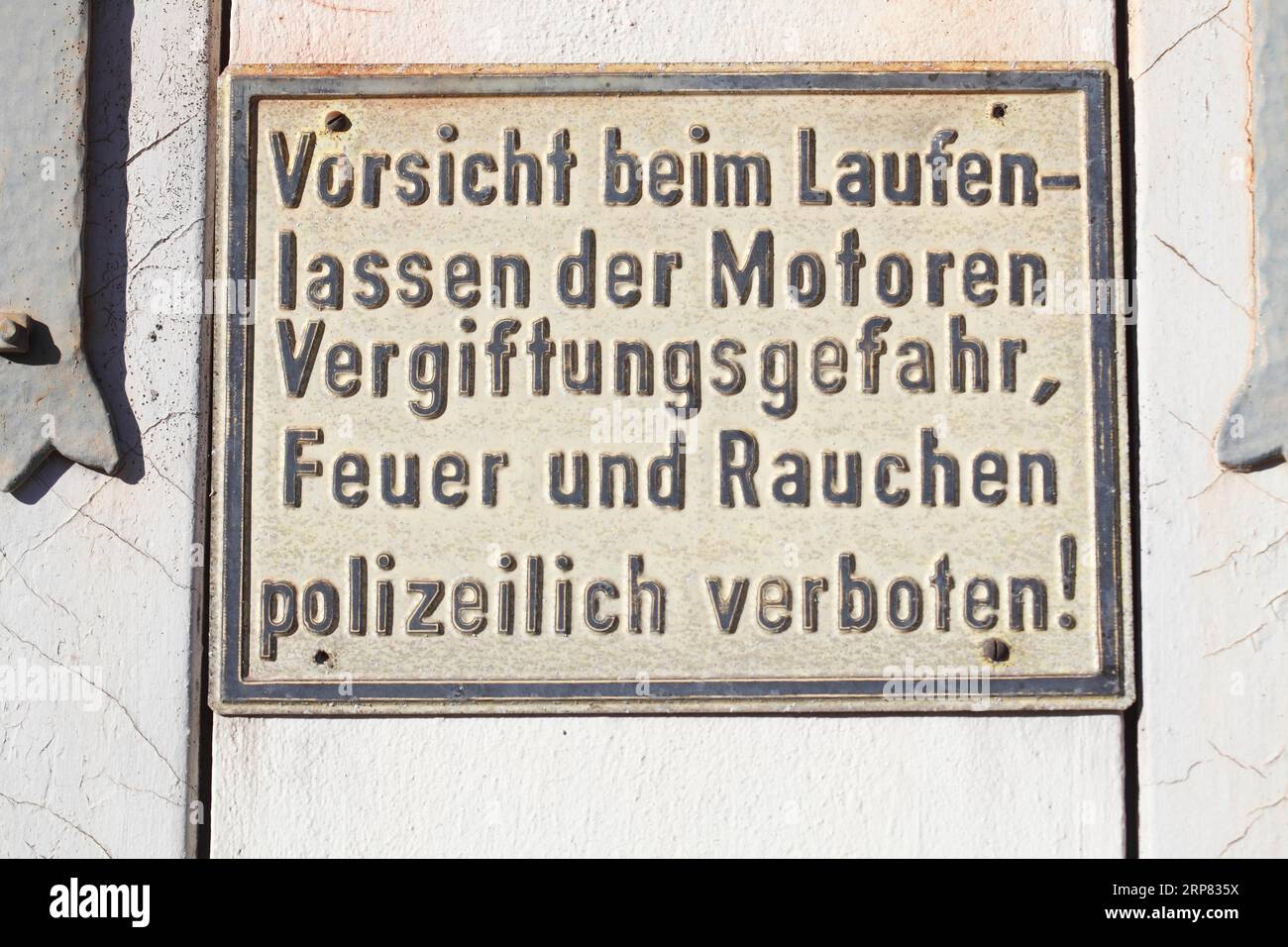 Old warning sign Caution when running the engines, danger of poisoning ...