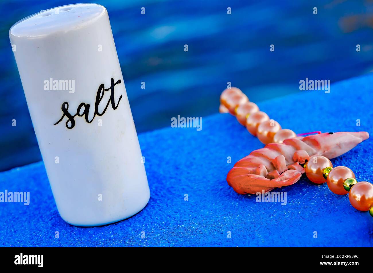 A salt shaker and a pink crustacean necklace is left by Jimmy Buffett ...