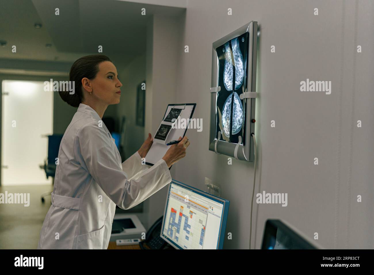Side view of professional doctor radiologist analyzing scan MRI images ...