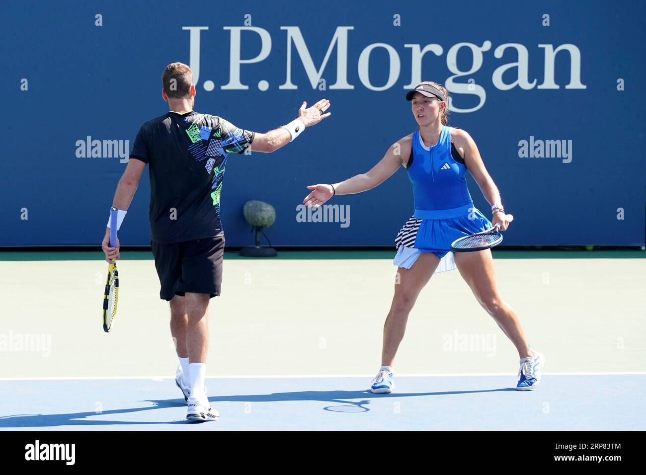 Austin Krajicek high fives Jessica Pegula during a mixed doubles match at the 2023 US Open ...