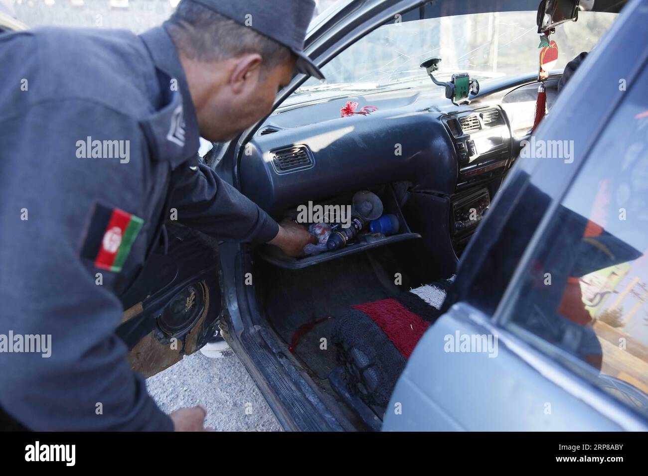 (190224) -- HERAT, Feb. 24, 2019 -- An Afghan policeman searches a ...