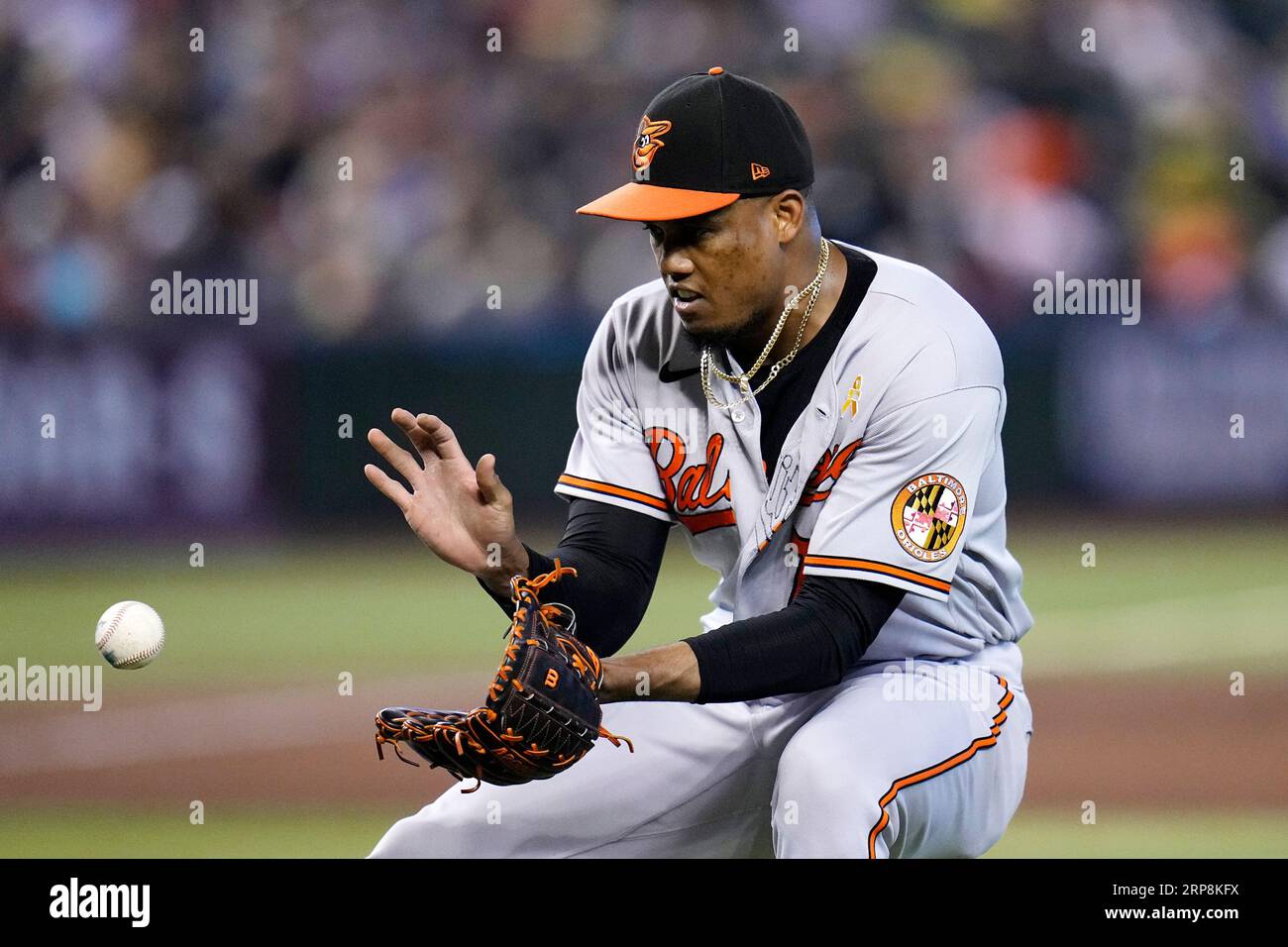 Baltimore Orioles relief pitcher Yennier Cano fields a grounder hit by ...