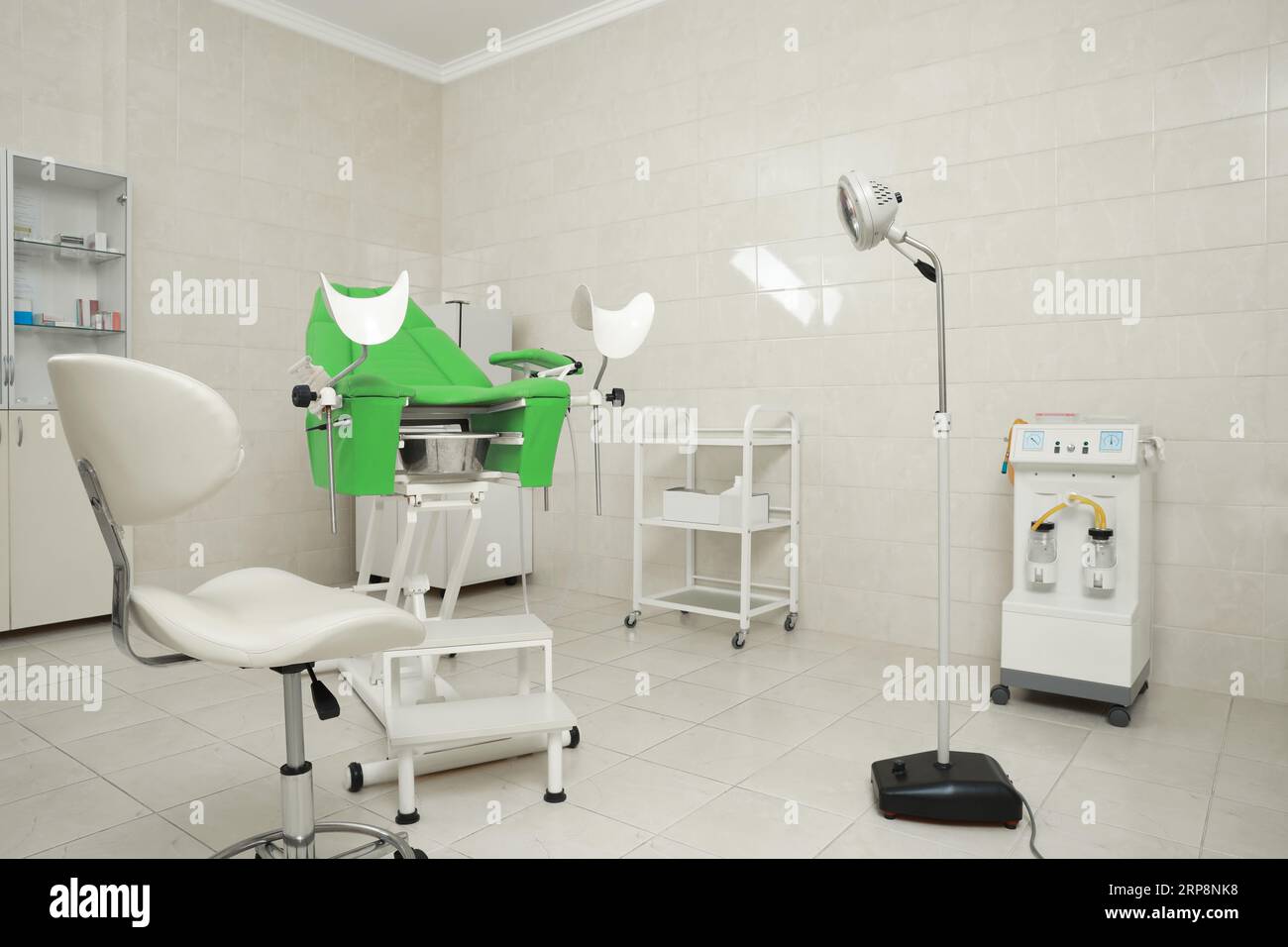 Modern gynecological office interior with examination chair and medical ...